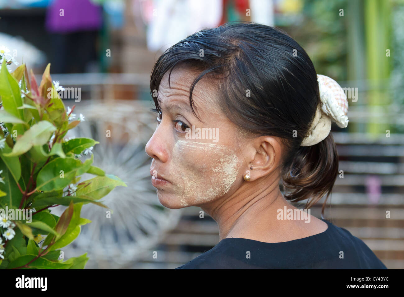 Woman with traditional Thanaka Make-Up in her Face in Rangoon, Myanmar ...