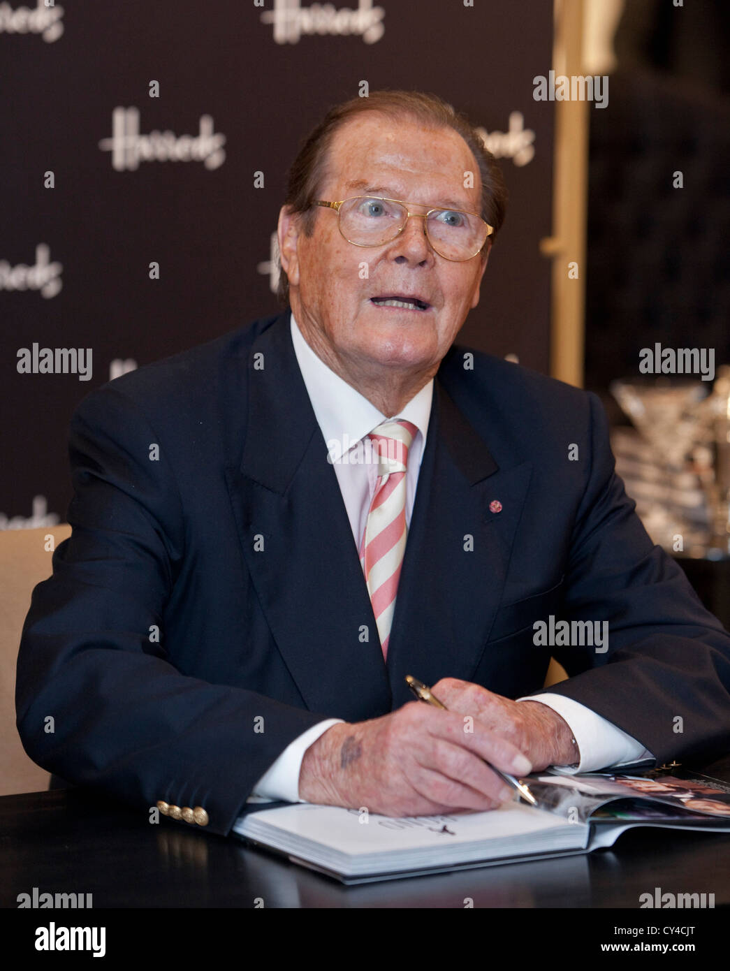 roger moore , actor, signs copies of his new book 'bond on bond' at ...