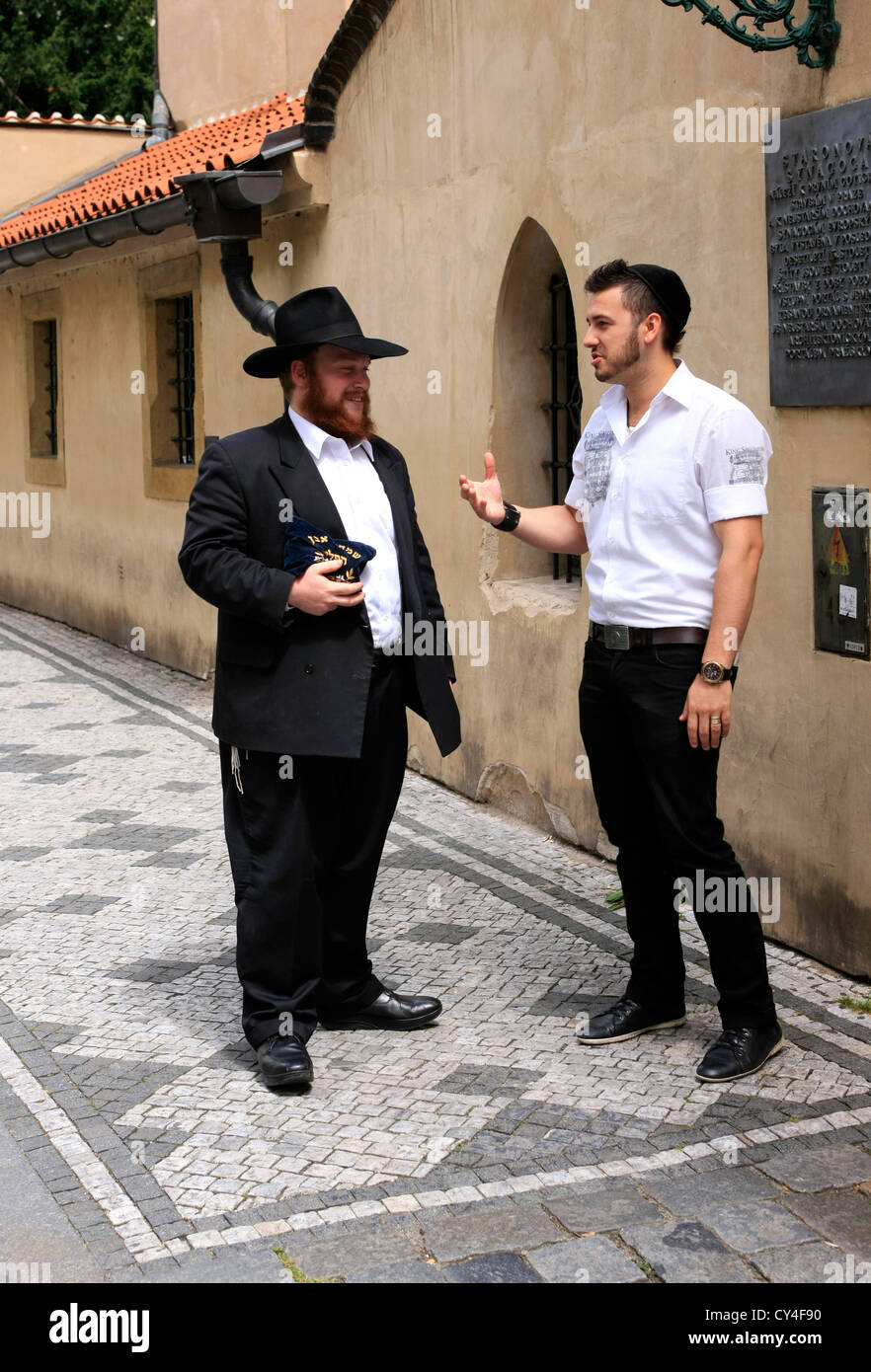 Rabbi talking to one of his congregation outside the Synagogue in ...