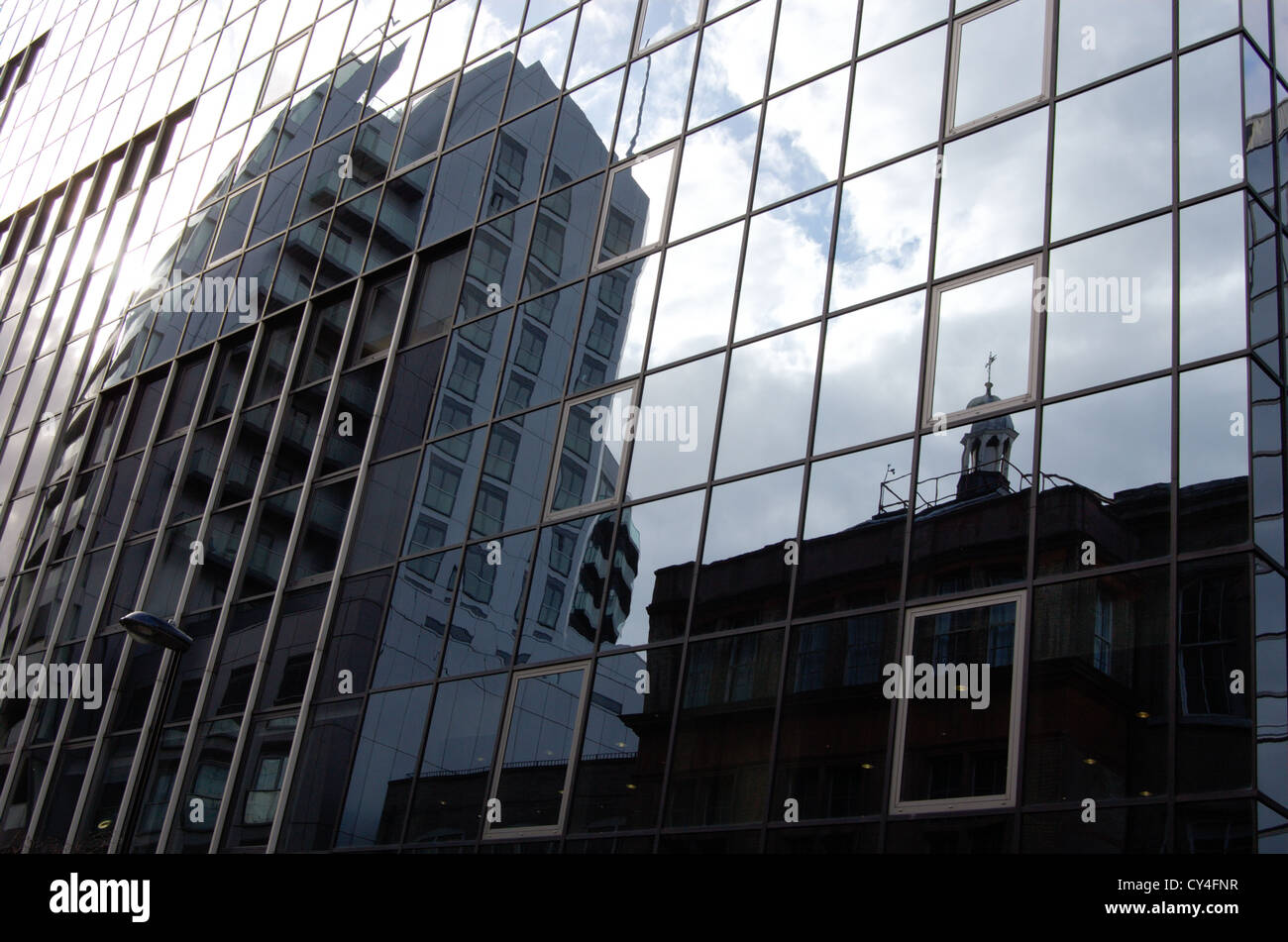 Reflection on glass wall of a modern office building Stock Photo - Alamy