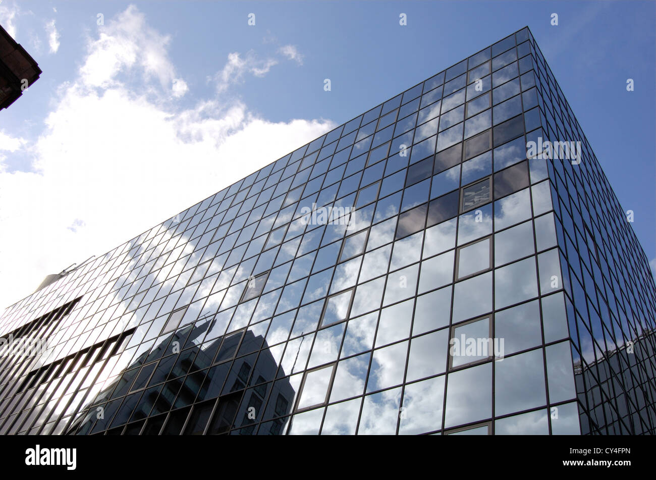 Reflection on glass wall of a modern office building Stock Photo - Alamy
