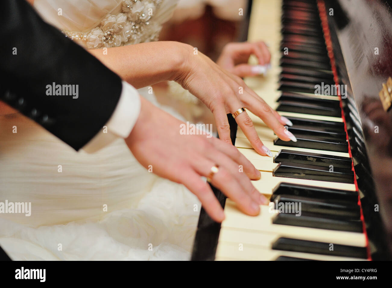 Couple hand on piano hi-res stock photography and images - Alamy