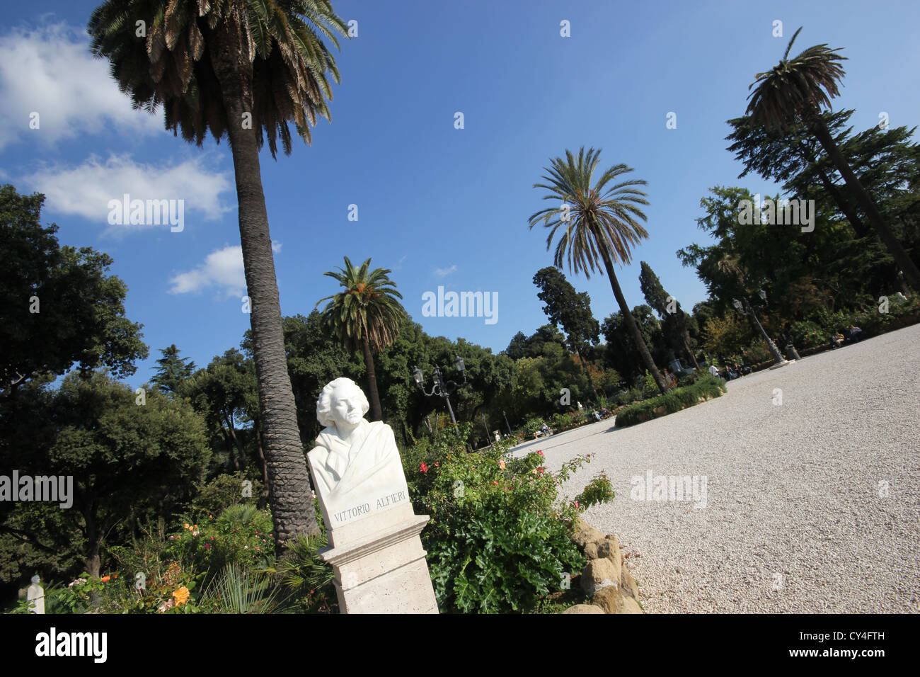 beautiful white statue in Roman park against blue clear sky, in summer ...