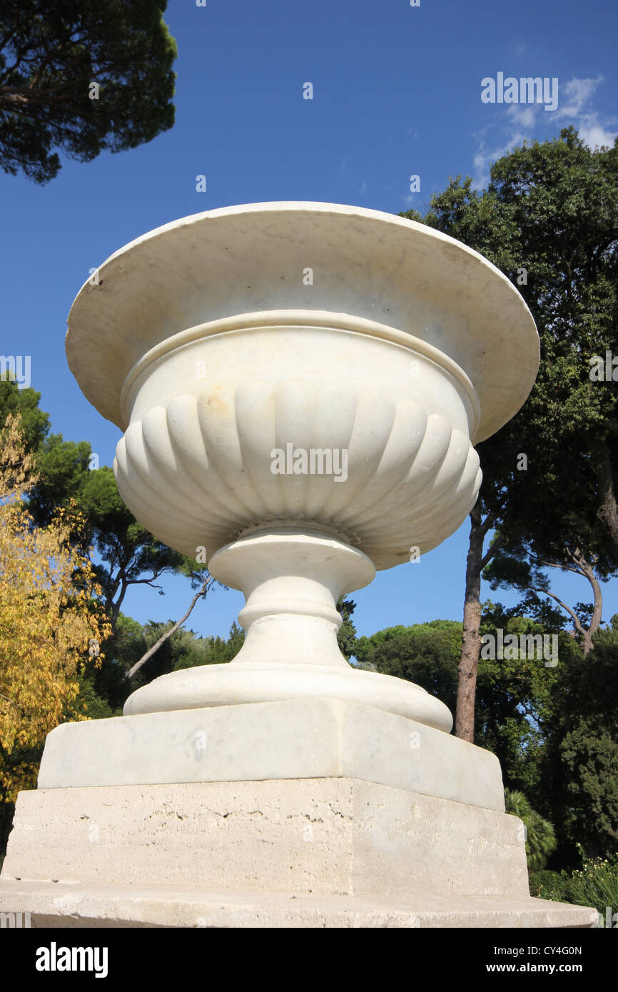 beautiful big vase in Roman park against blue clear sky, anfora in ...