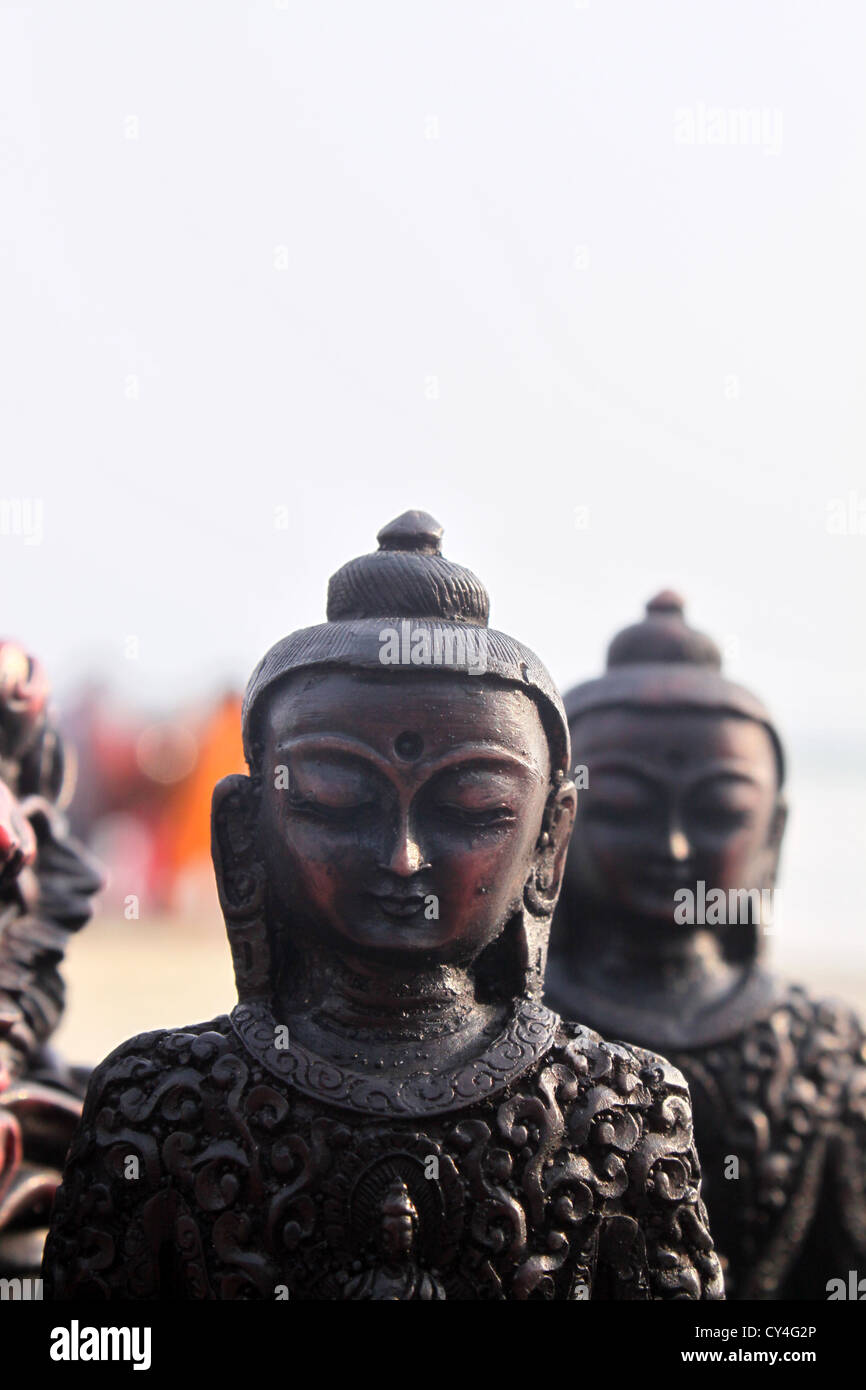 black Buddha statue with white background Stock Photo - Alamy