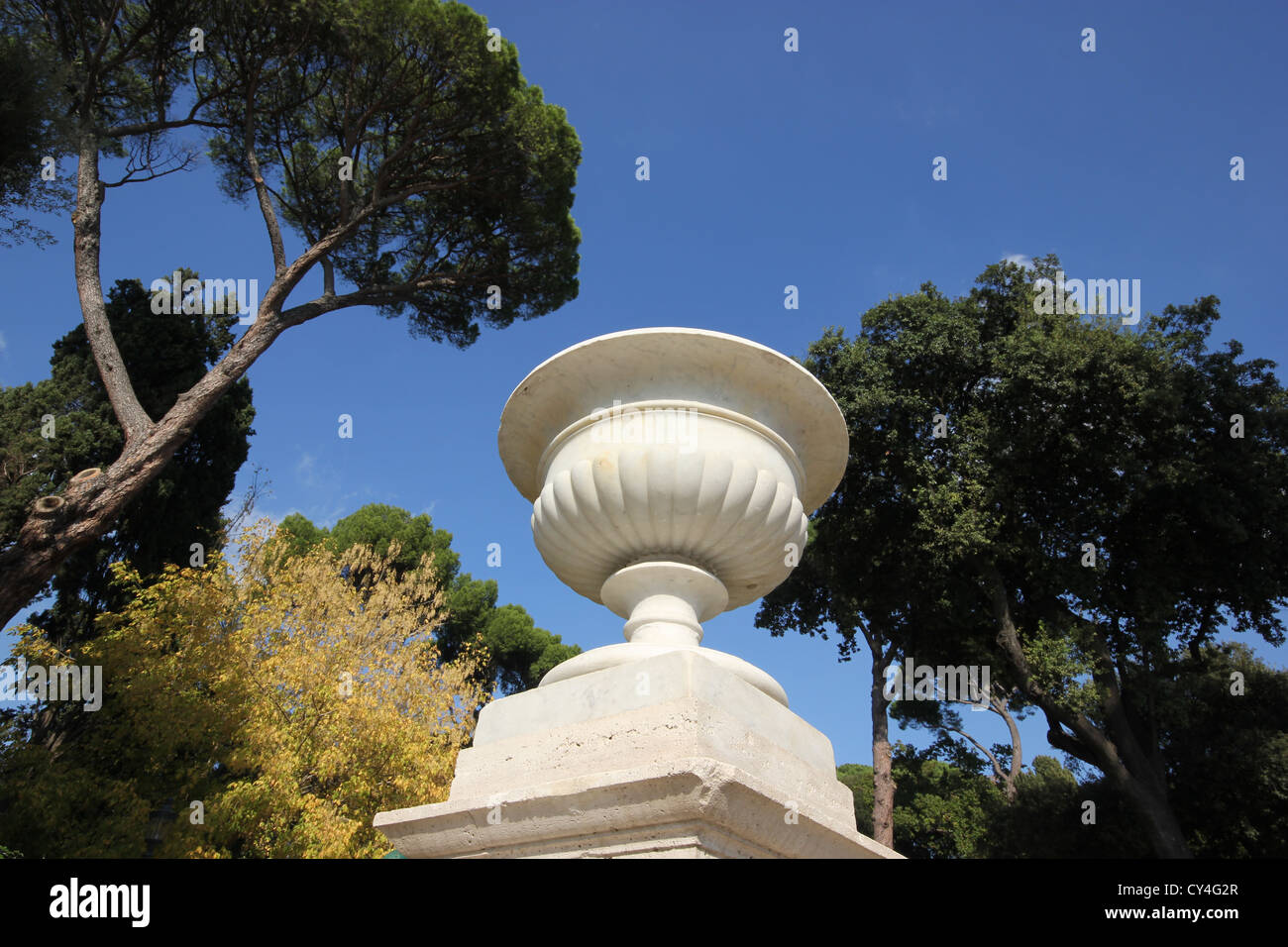 beautiful big vase in Roman park against blue clear sky, anfora in ...