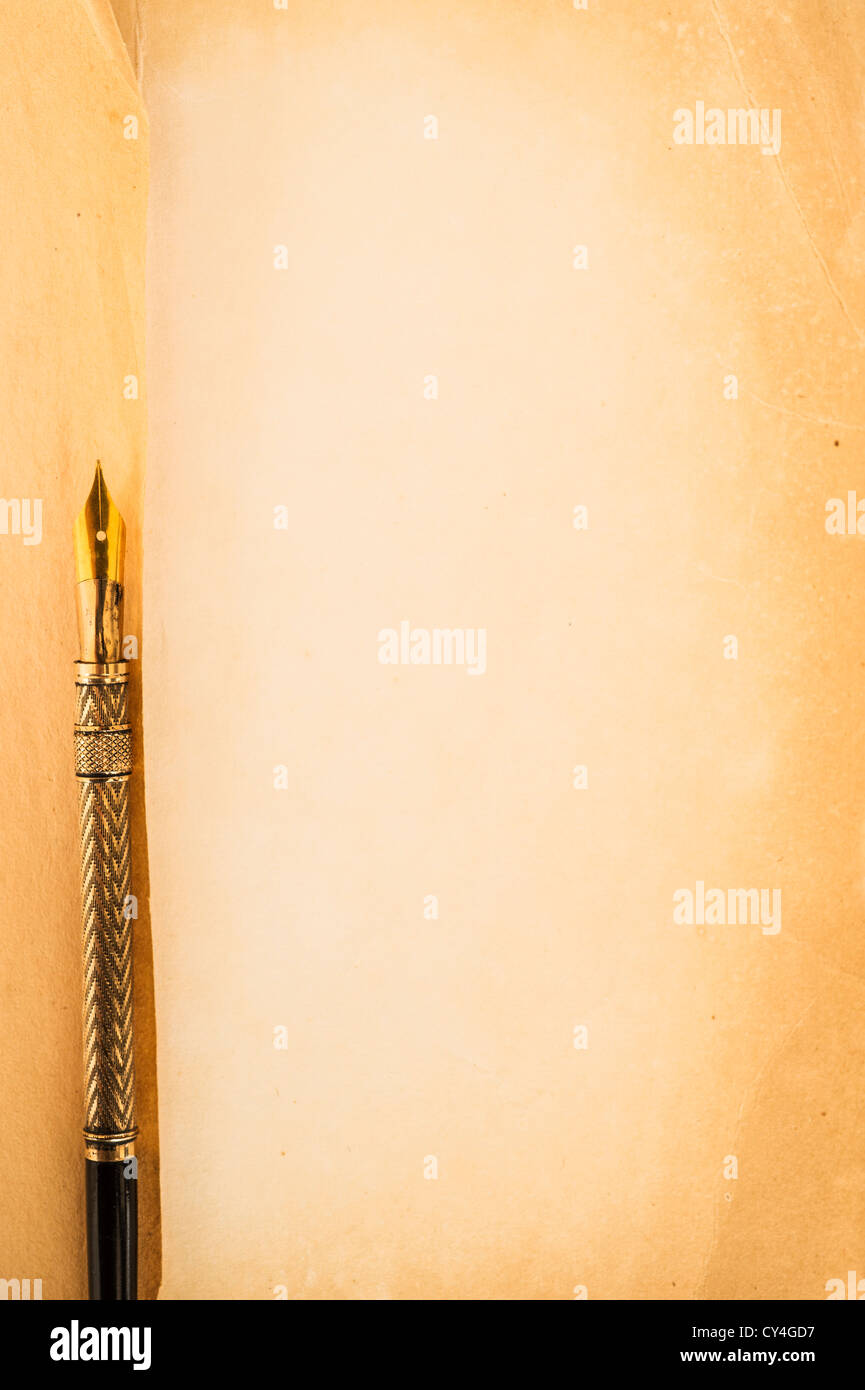 Old brown paper with fountain pen, studio shot Stock Photo - Alamy