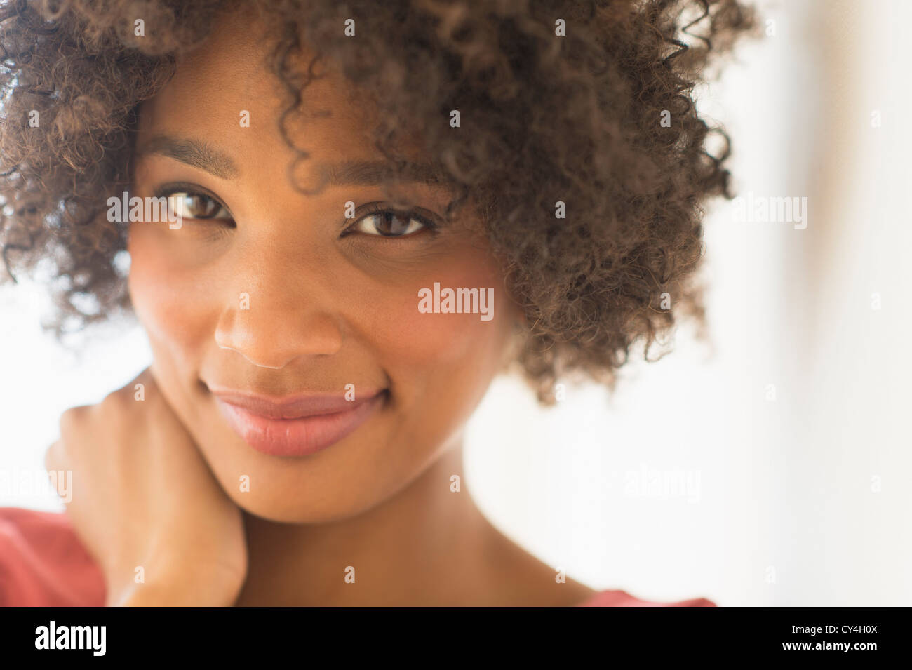 Portrait of woman smiling, studio shot Stock Photo - Alamy
