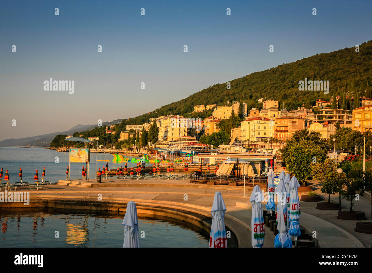 View of the Croatian resort of Opatija on the Adriatic Coast at sunset ...