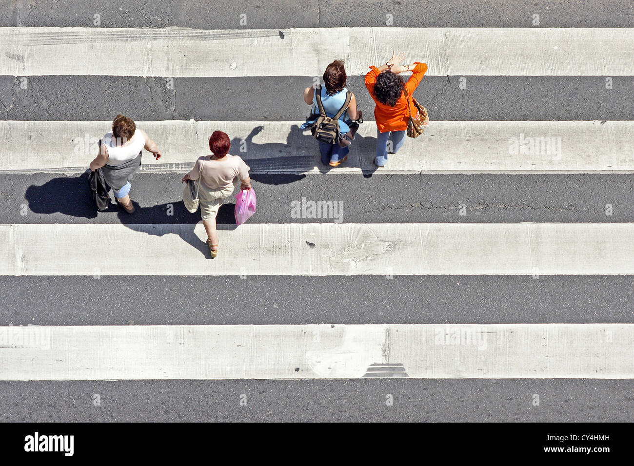 Pedestrians on a zebra crossing Stock Photo - Alamy