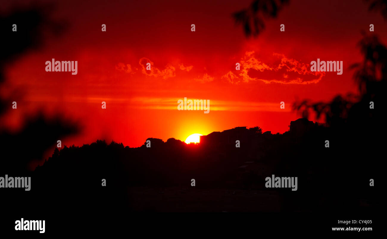 Red sunset sky with dramatic clouds Stock Photo - Alamy