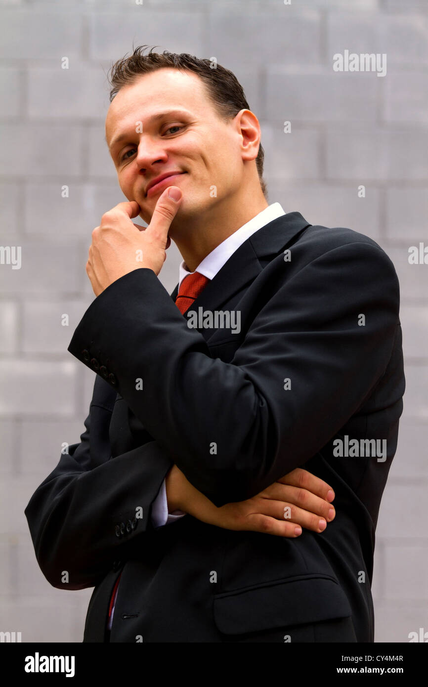 Happy smiling young businessman front the camera Stock Photo - Alamy