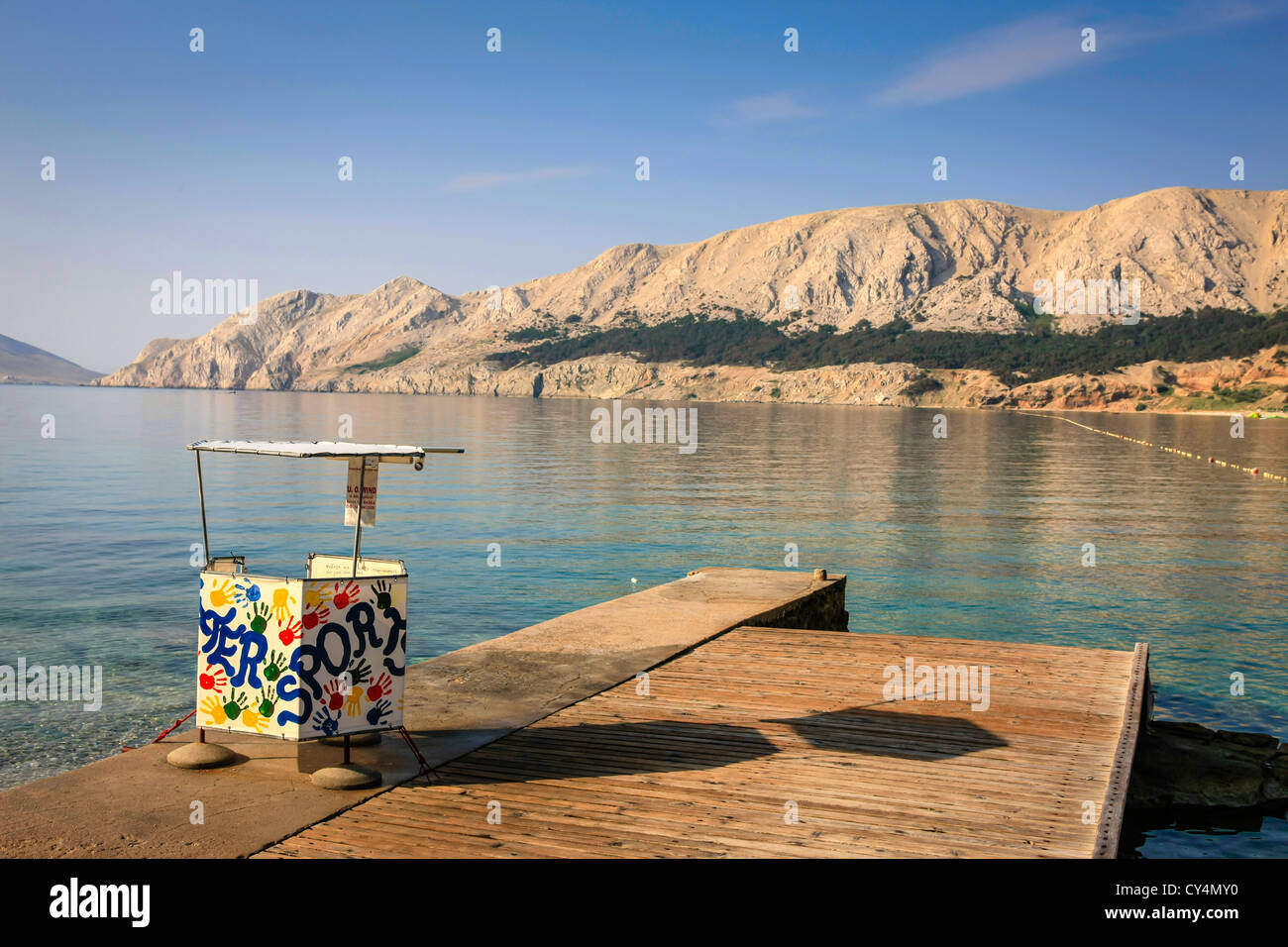 The flat calm waters of the Adriatic at Baska on the island of Krk ...