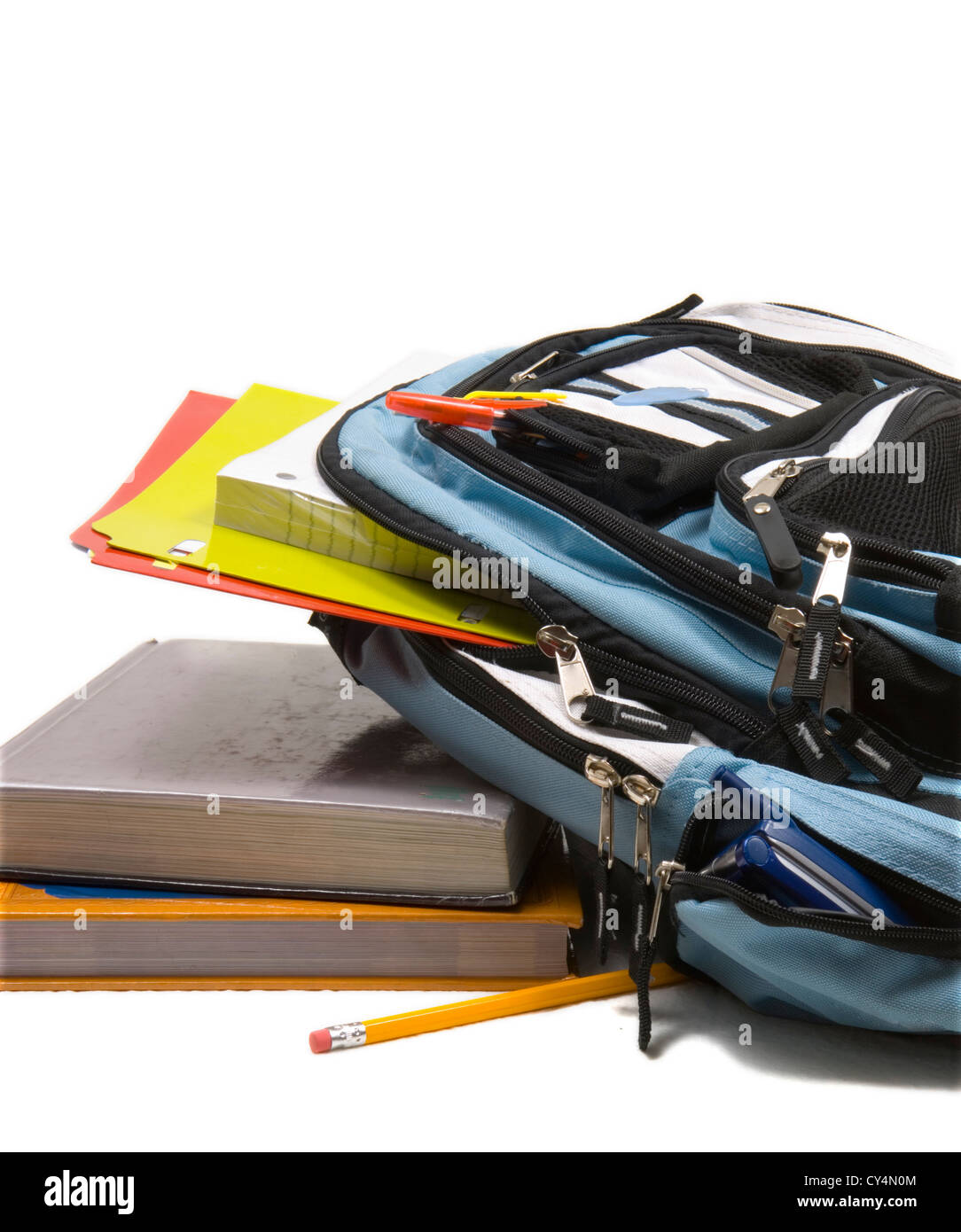 Blue school back pack full of school supplies with paper, folders and ...