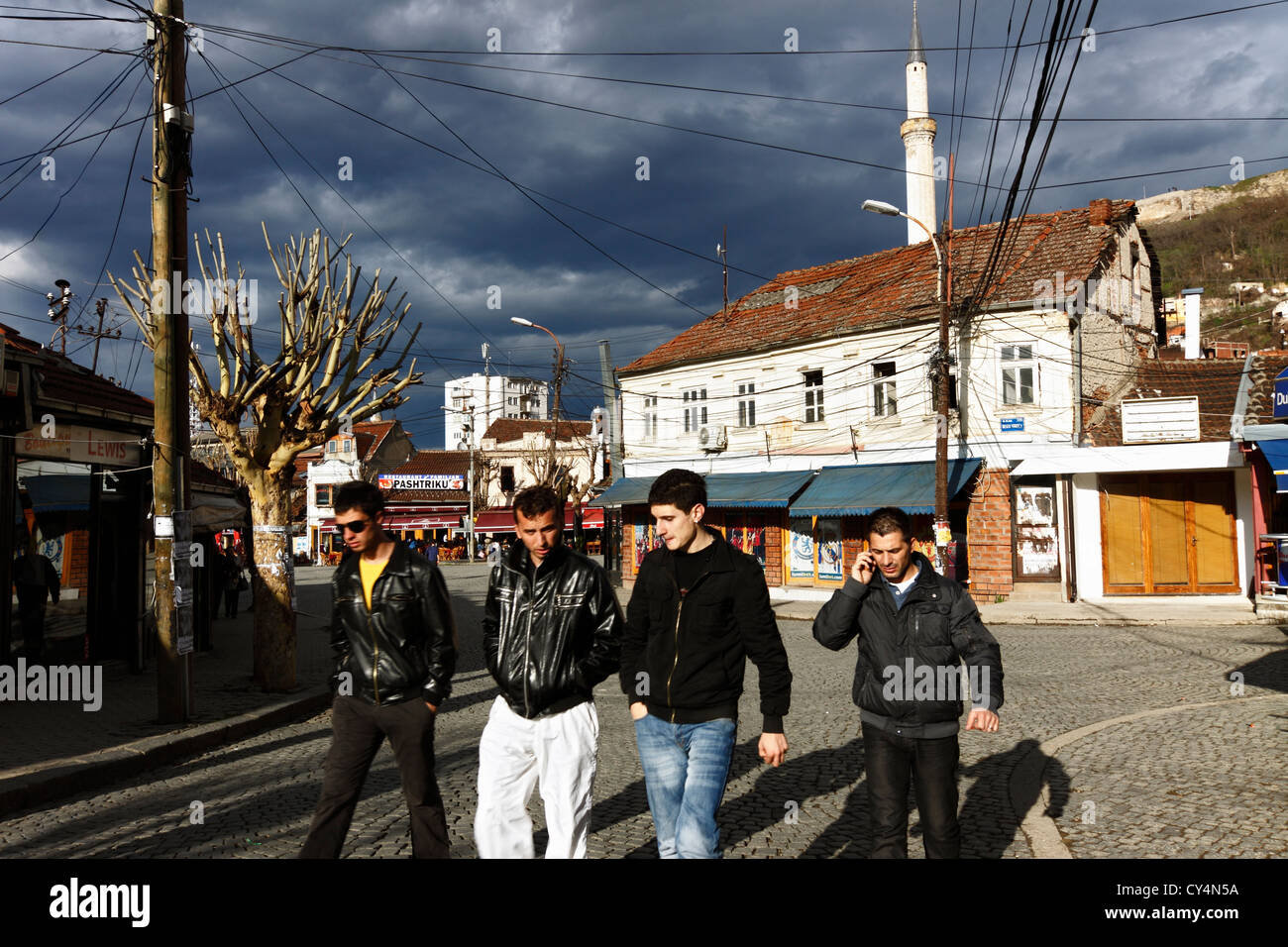 4 young Kosovar young men in a Prizren street, Kosovo Stock Photo - Alamy