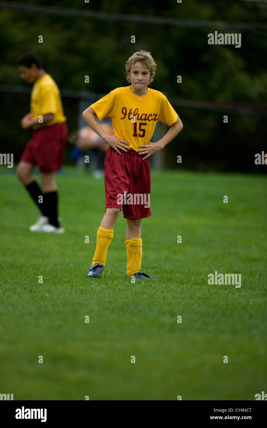 Boy on soccer field Stock Photo - Alamy