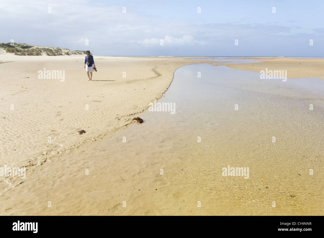 Woman walking along the beach at Manyana, NSW Stock Photo - Alamy