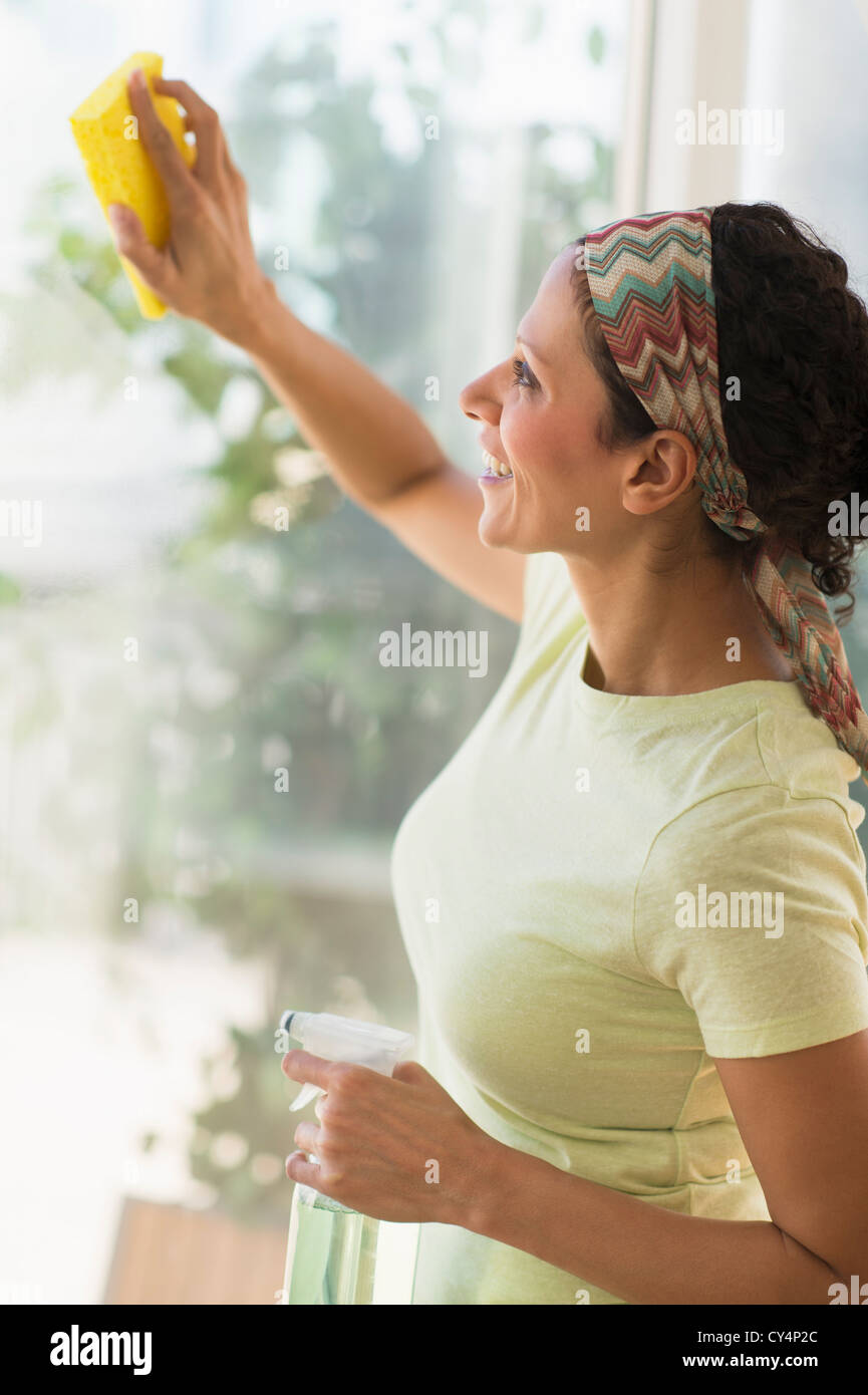 USA, New Jersey, Jersey City, Woman cleaning window Stock Photo - Alamy