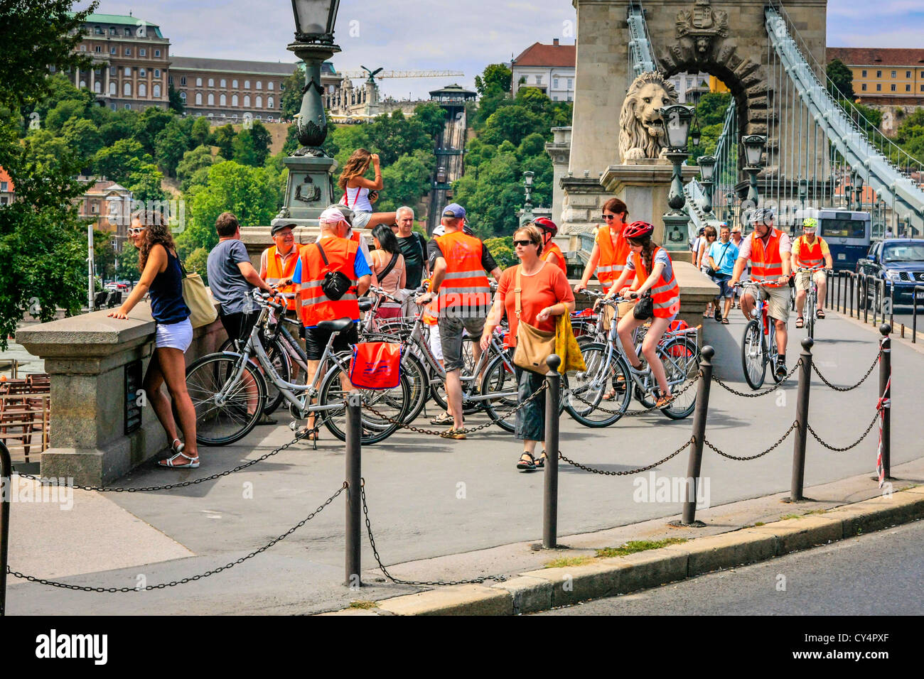A cycling group in Budapest all wearing Hi-Vis Orange vests Stock Photo ...