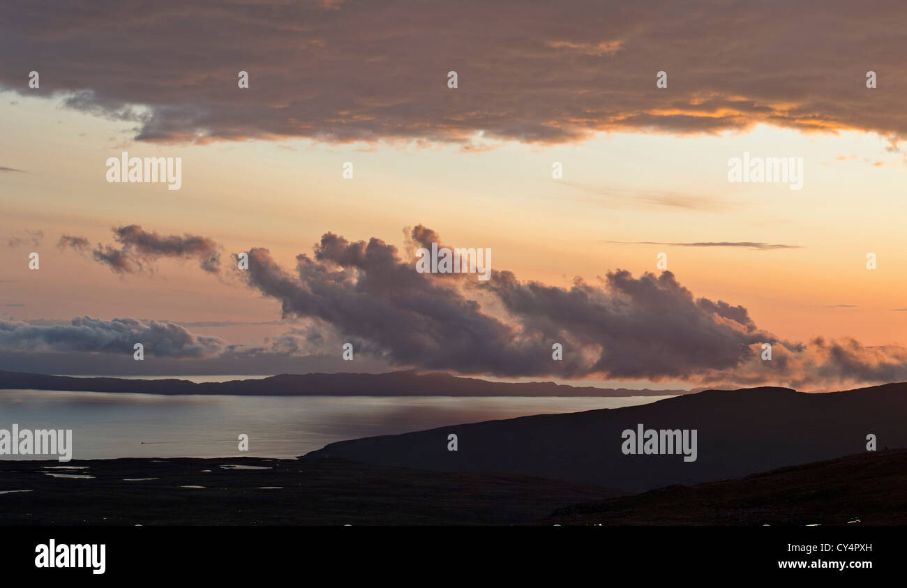 Wisps of late-evening cloud hang over the narrow sea-channels between ...