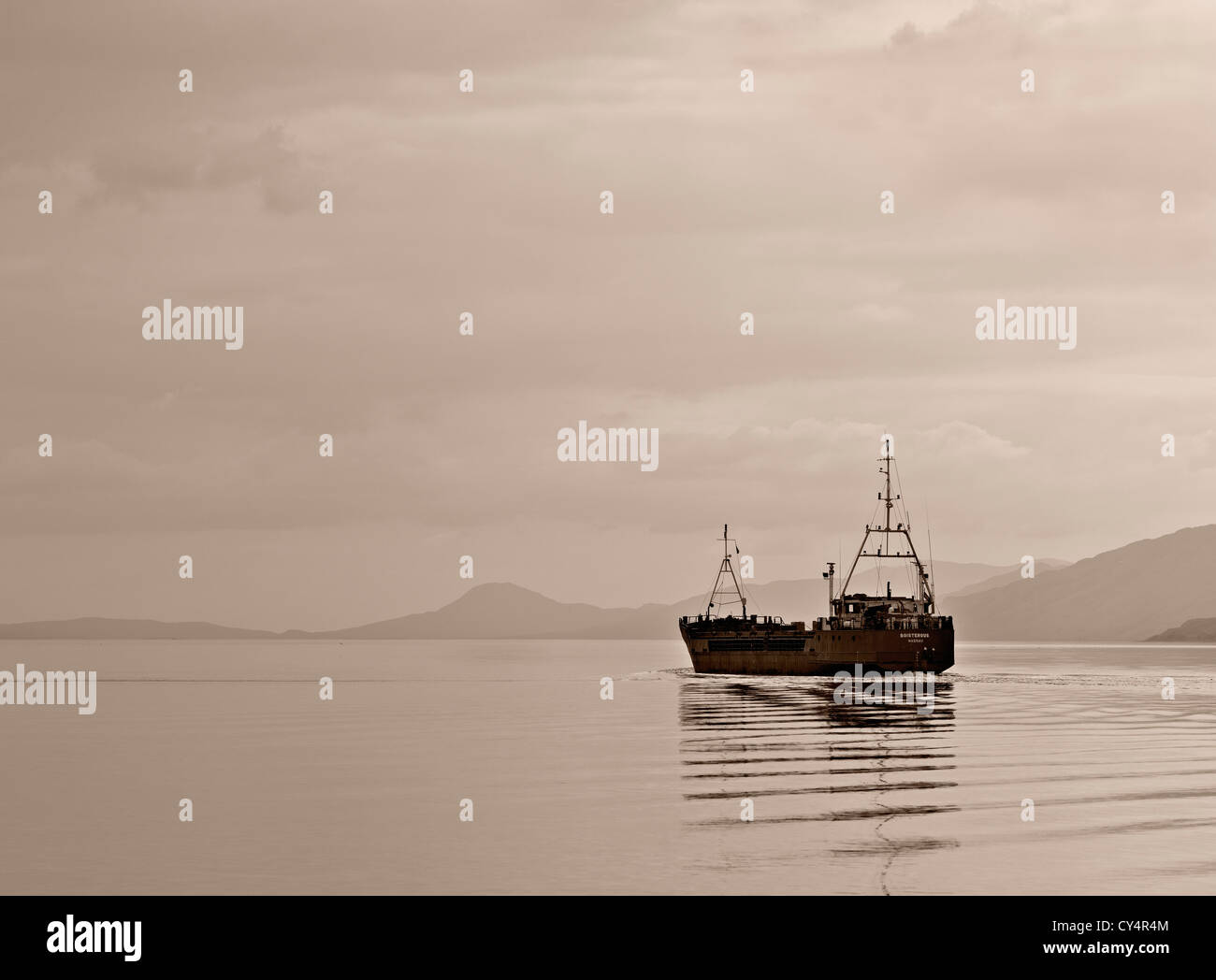 Coastal vessel steams in quiet inshore waters at Loch Linnhe, Scottish ...
