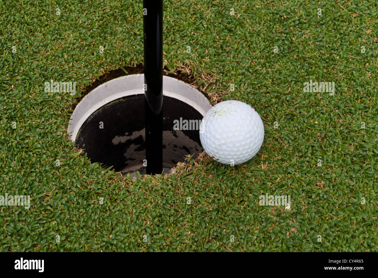The golf holes, golf ball close to the hole Stock Photo - Alamy