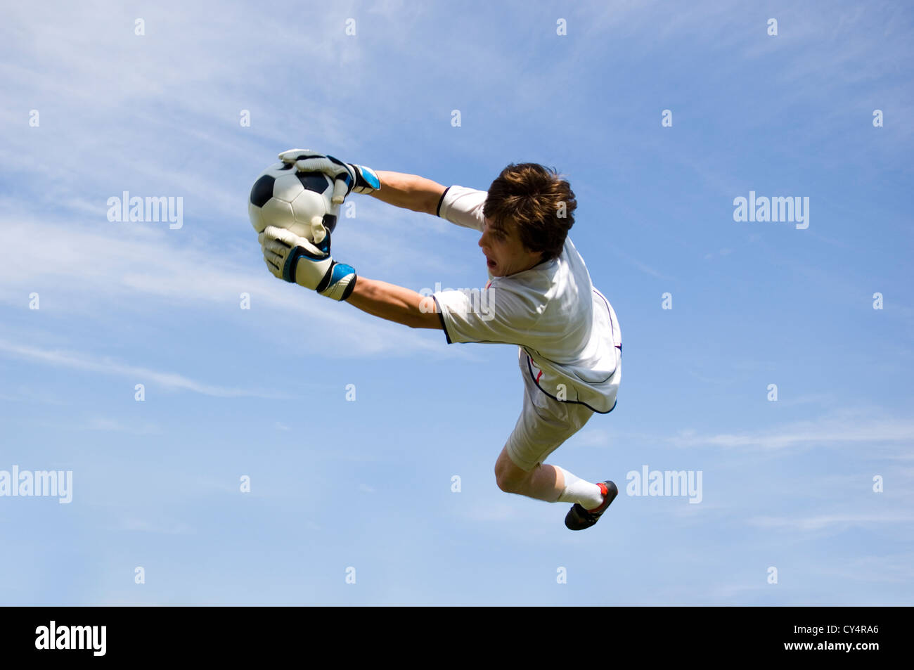 Soccer Football Goalie making diving save Stock Photo - Alamy