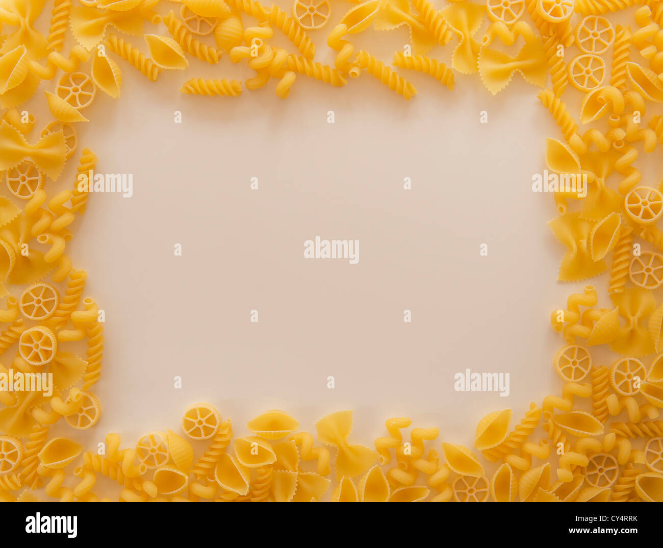 Variety of yellow pasta with blank white space in middle Stock Photo ...
