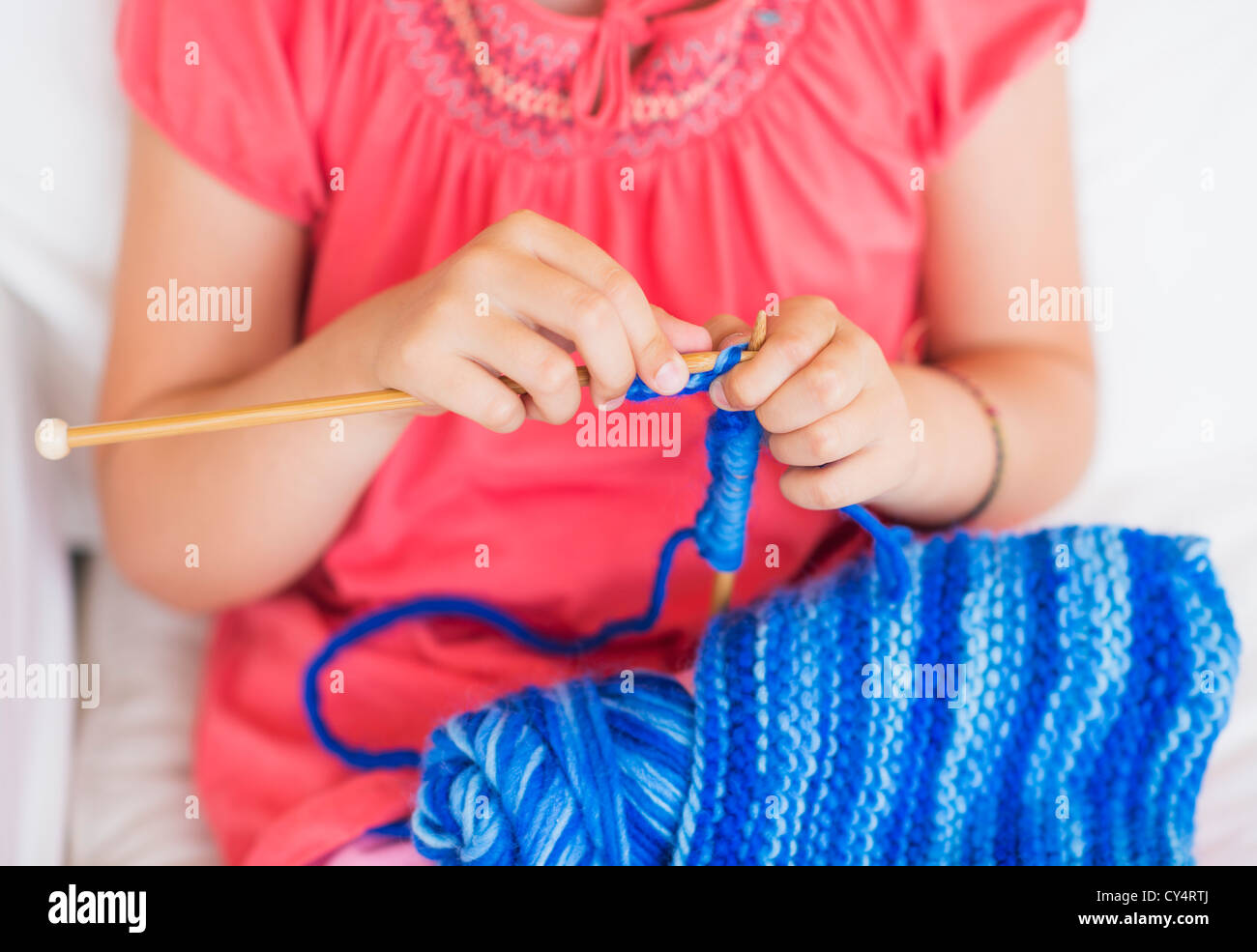 Young girl (8-9) knitting Stock Photo - Alamy