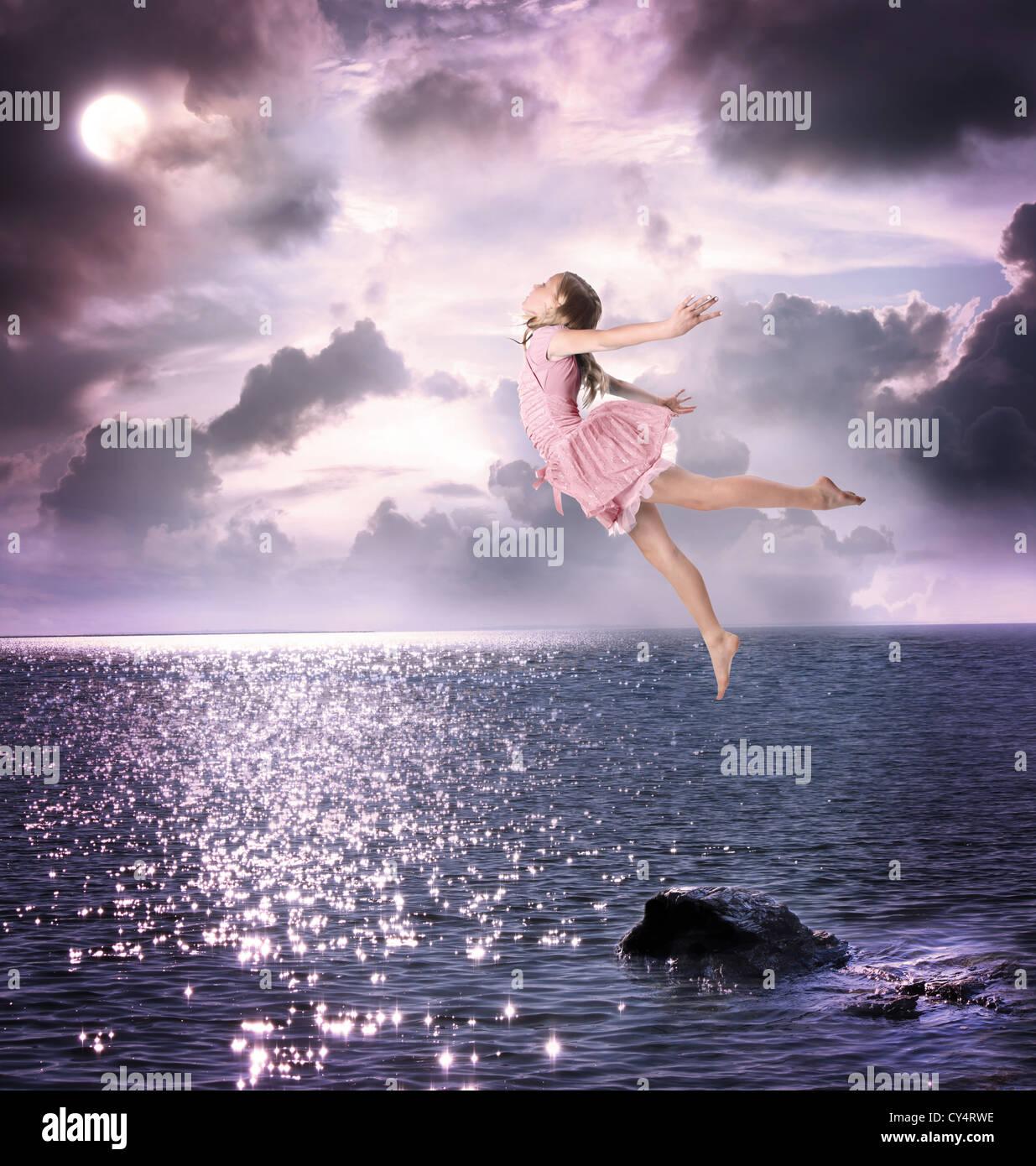 Little Blonde Girl Flying Into the Night Sky Stock Photo - Alamy
