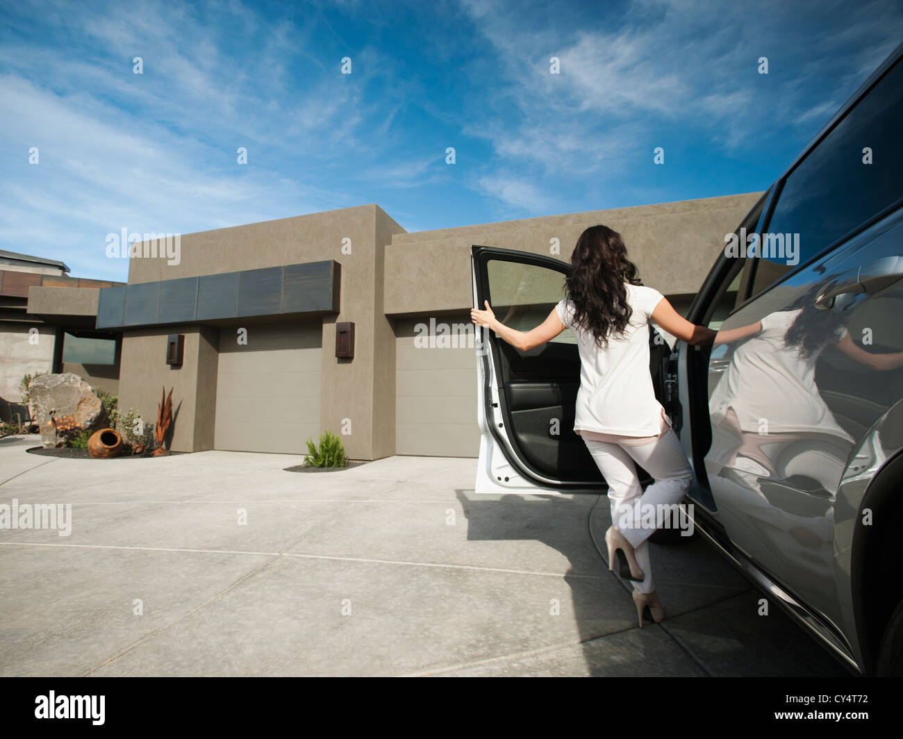 USA, Utah, St. George, Young woman getting in car Stock Photo - Alamy