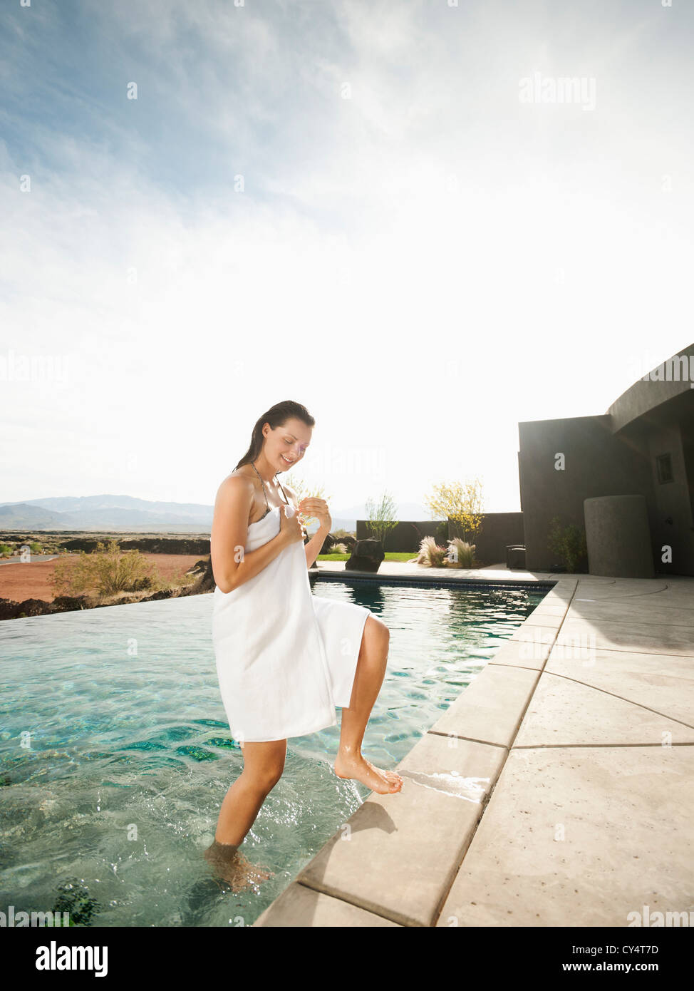 USA, Utah, St. George, Young attractive woman emerging from swimming ...