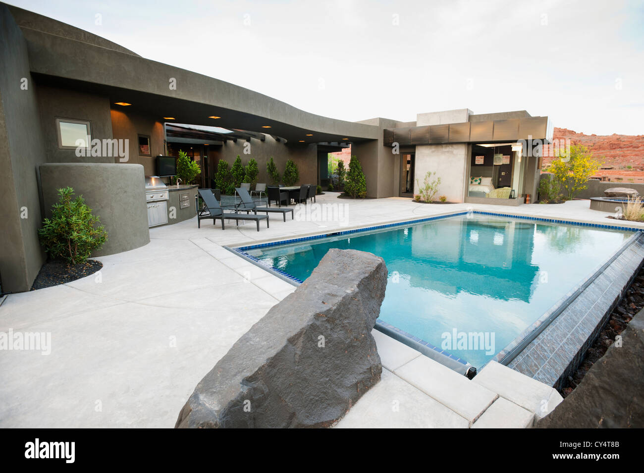 USA, Utah, St. George, Modern luxury home facing swimming pool Stock ...