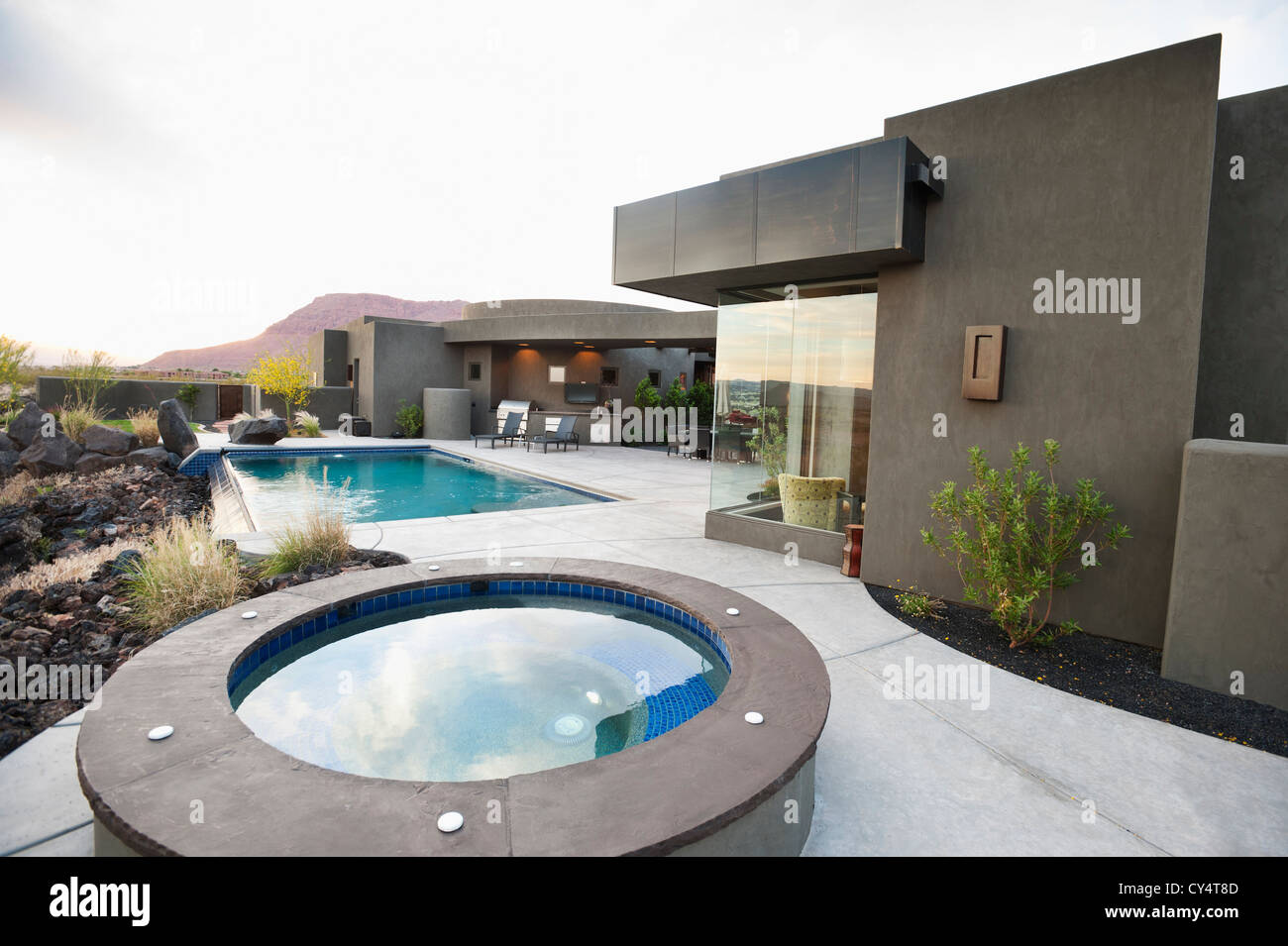 USA, Utah, St. George, Modern luxury home facing swimming pool Stock ...