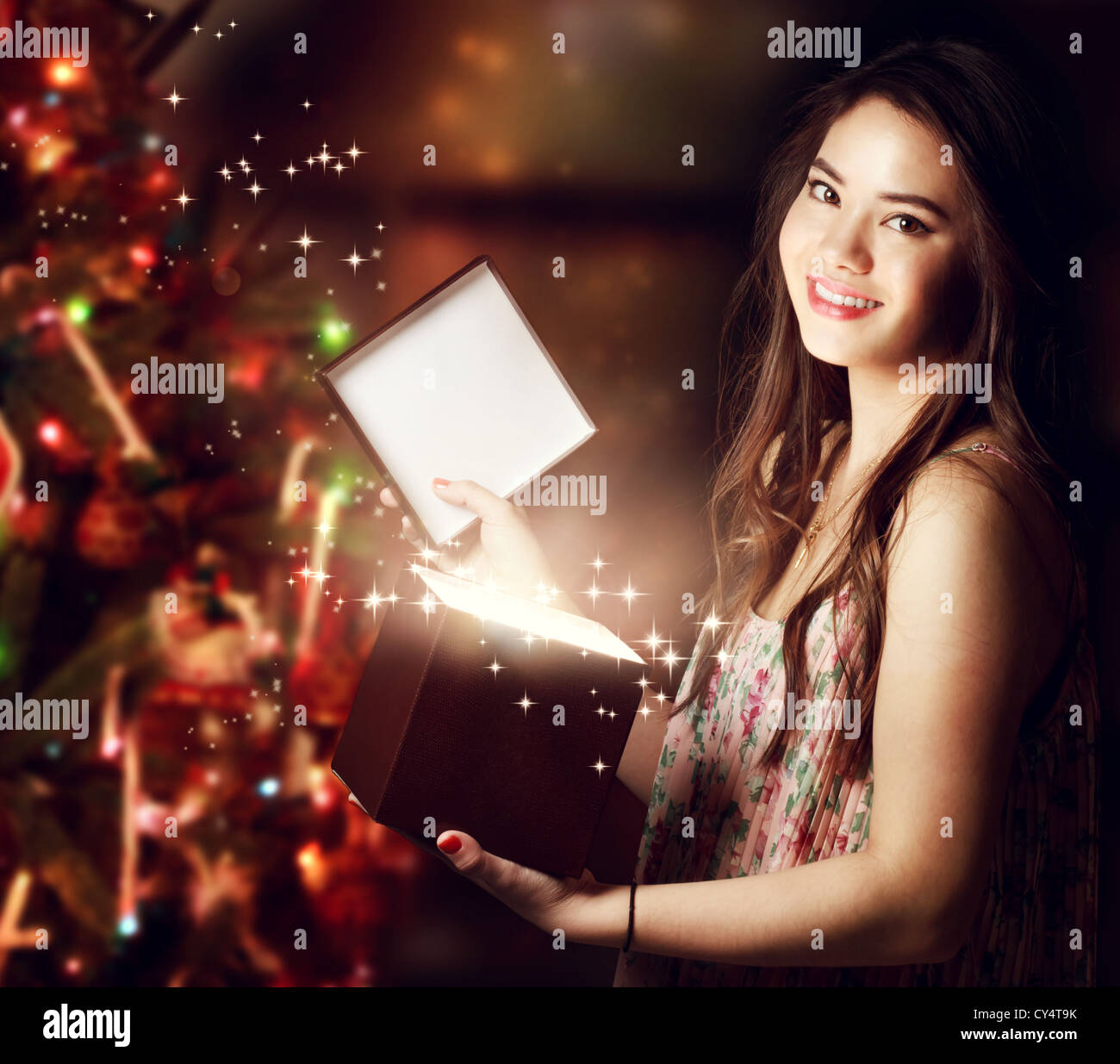 Happy Girl Opening a Gift Box Stock Photo - Alamy