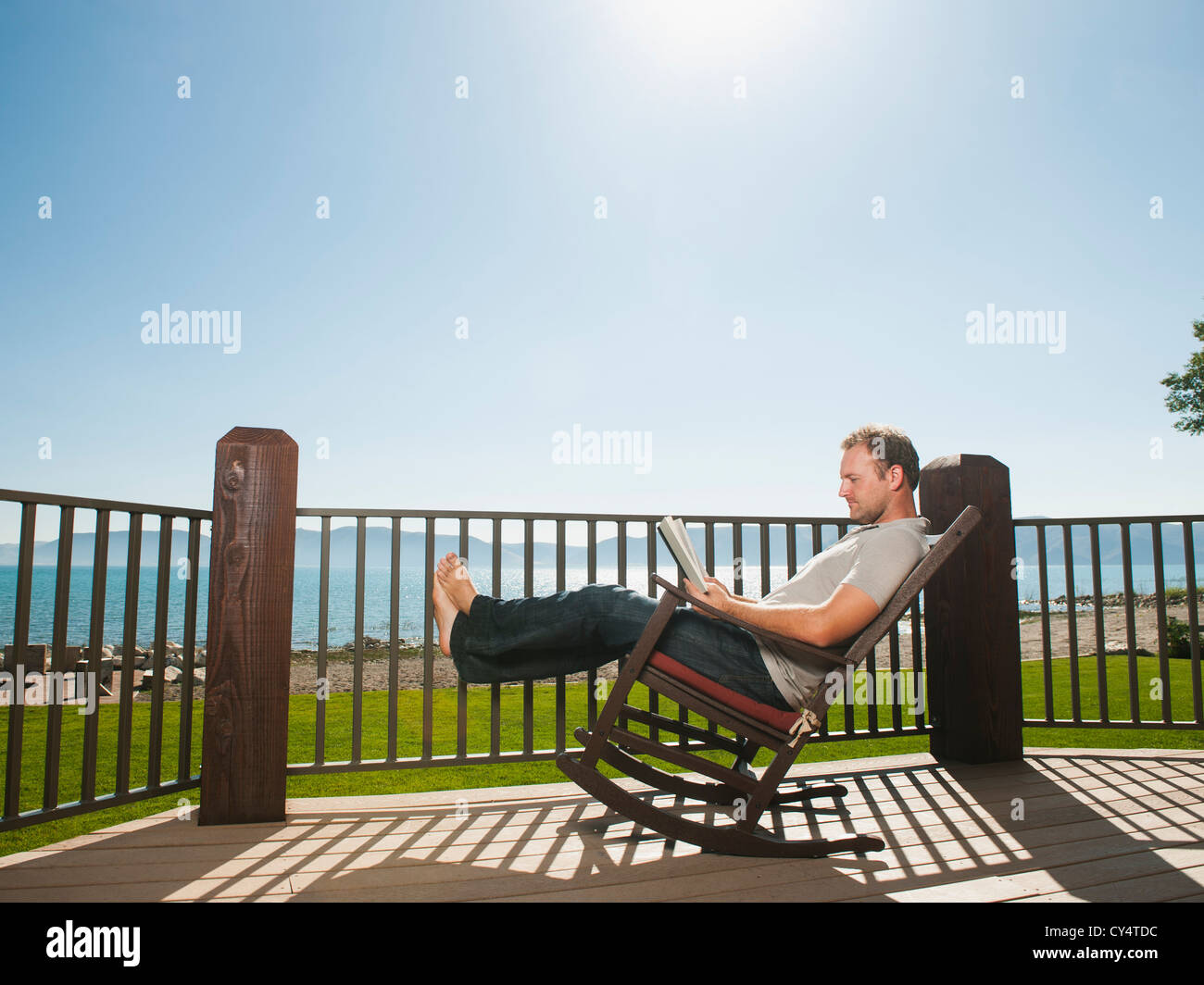 USA, Utah, Garden City, mid-adult man relaxing on rocking chair Stock ...