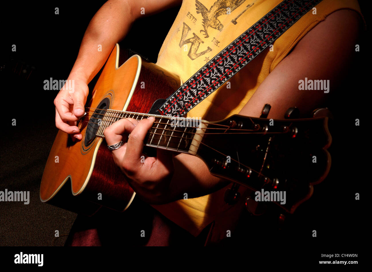 Acoustic Guitar being played Stock Photo - Alamy