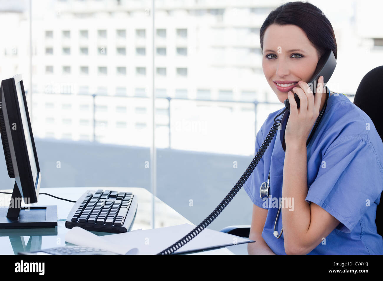 Female doctor on the phone Stock Photo - Alamy