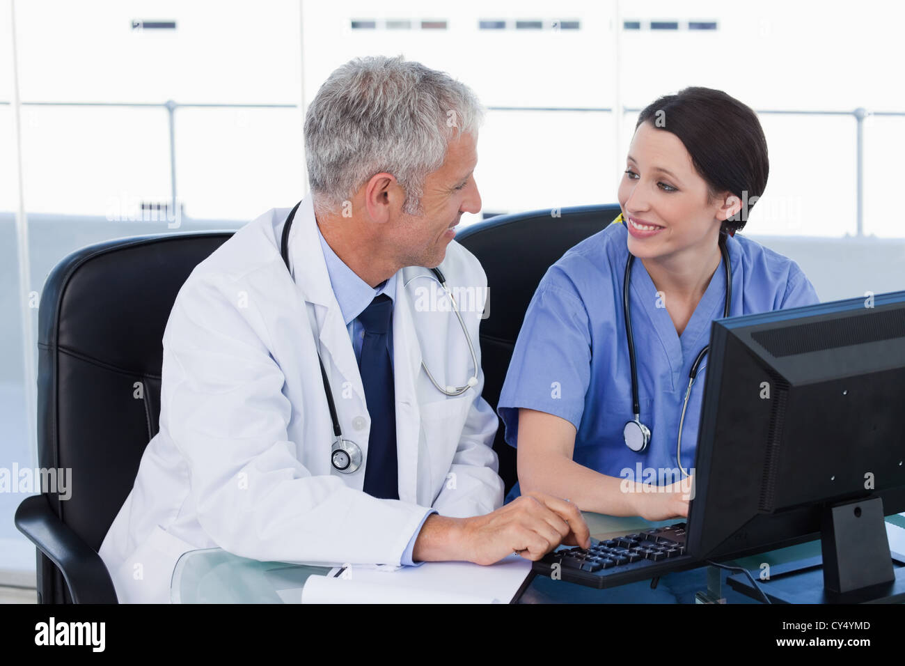 Medical team working with a computer Stock Photo - Alamy