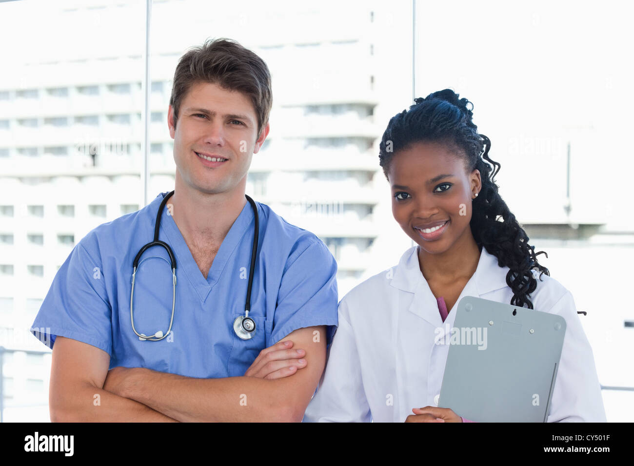 Happy doctors posing Stock Photo - Alamy
