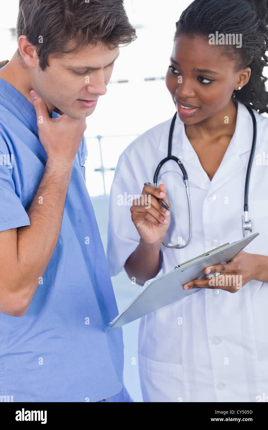 Portrait of doctors looking at a document Stock Photo - Alamy