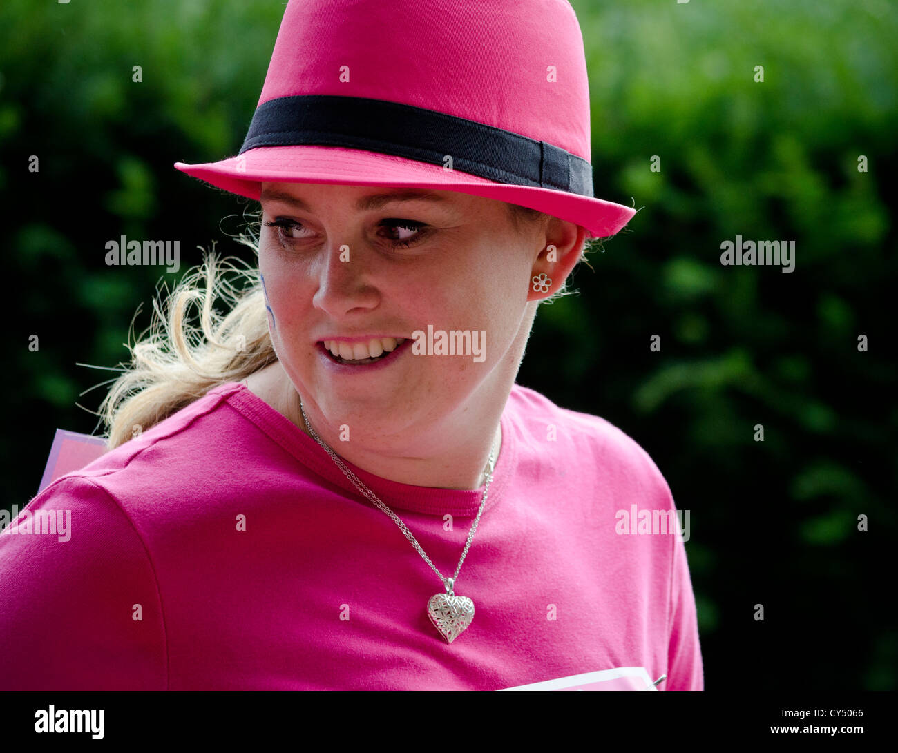 A woman raising money for cancer research on a fun run annual event ...