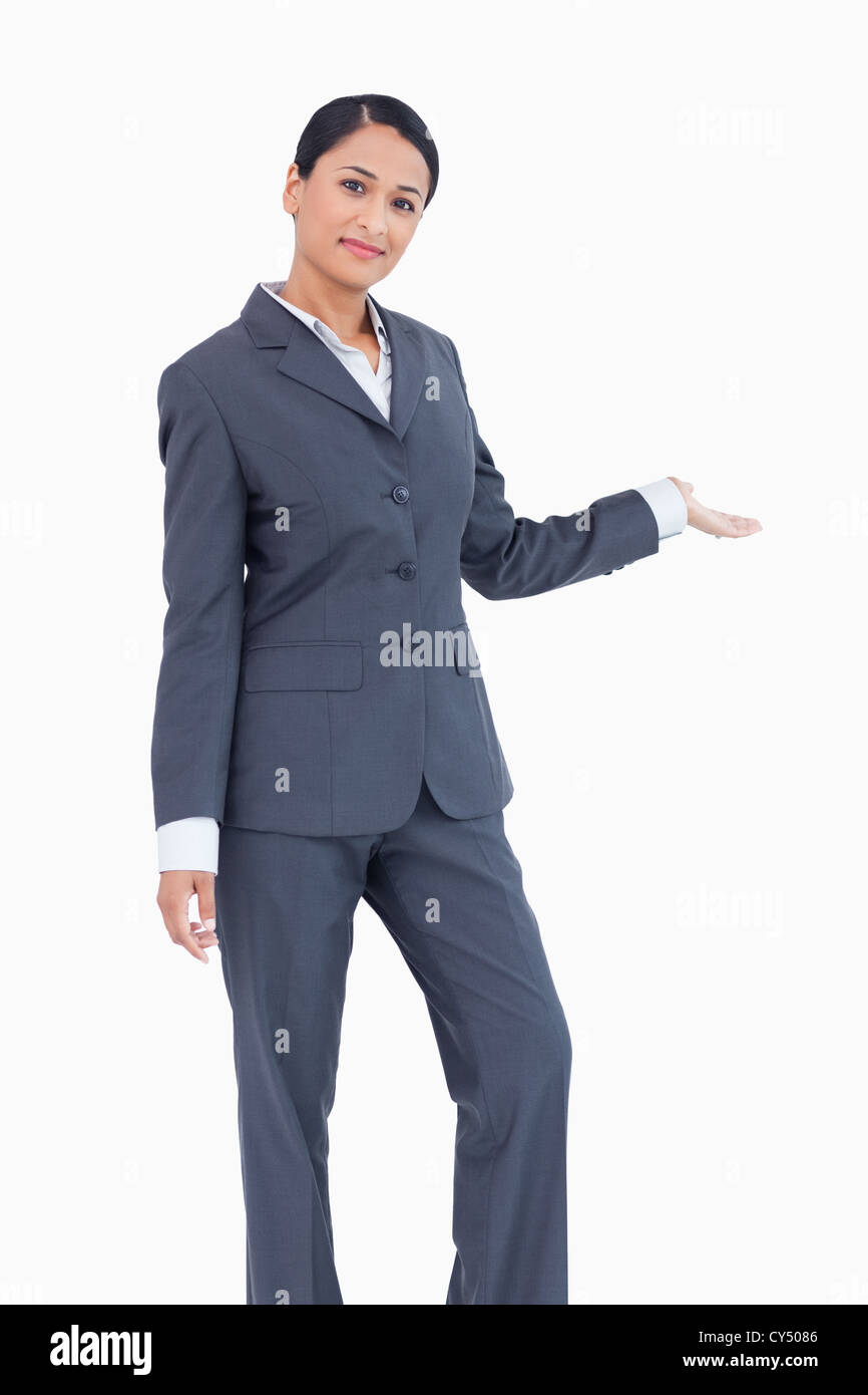 Standing businesswoman presenting Stock Photo - Alamy
