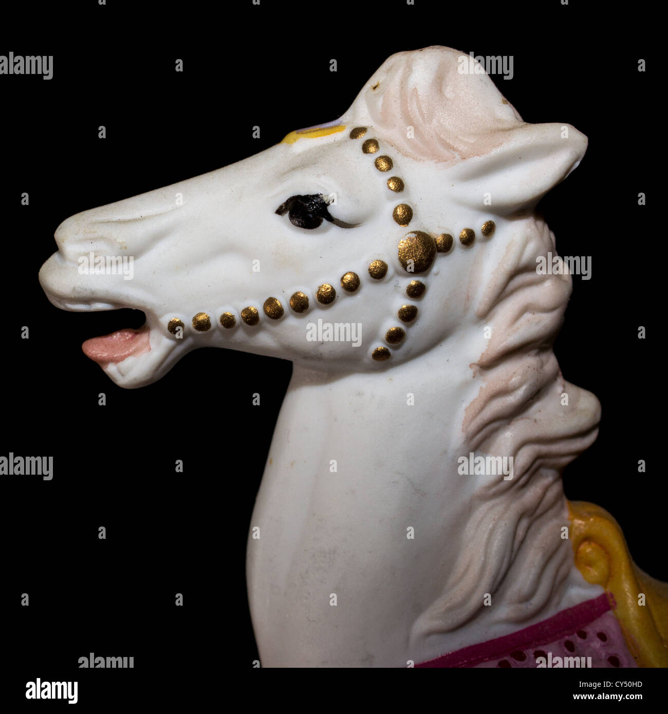 Colorful carousel horse isolated on black background Stock Photo - Alamy