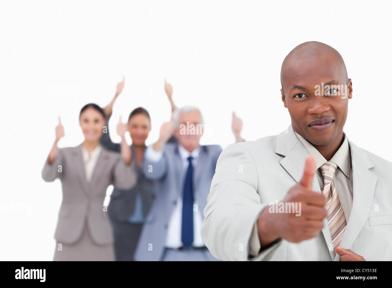Businessman with cheering team behind him giving approval Stock Photo ...