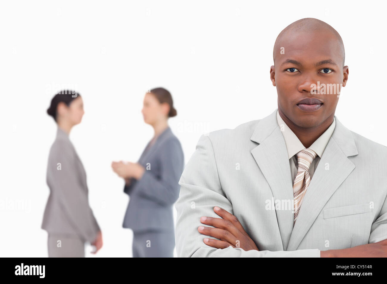 Tradesman with folded arms and colleagues behind him Stock Photo - Alamy Tradesman with folded arms and colleagues behind him Stock Photo - Alamy