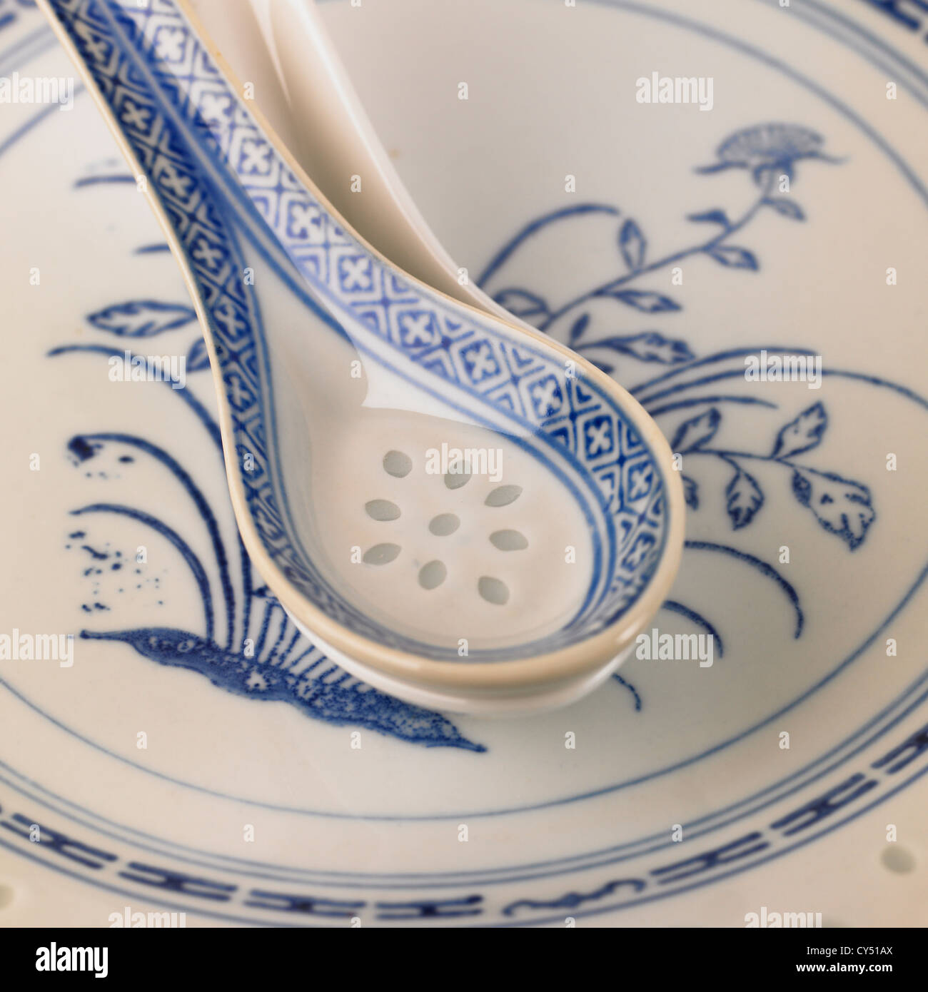 White and blue Chinese plate and spoons with rice pattern Stock Photo ...