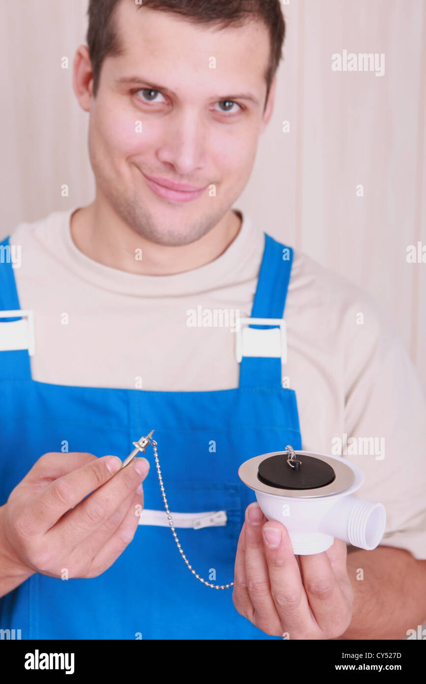 a plumber taking a water outlet Stock Photo - Alamy