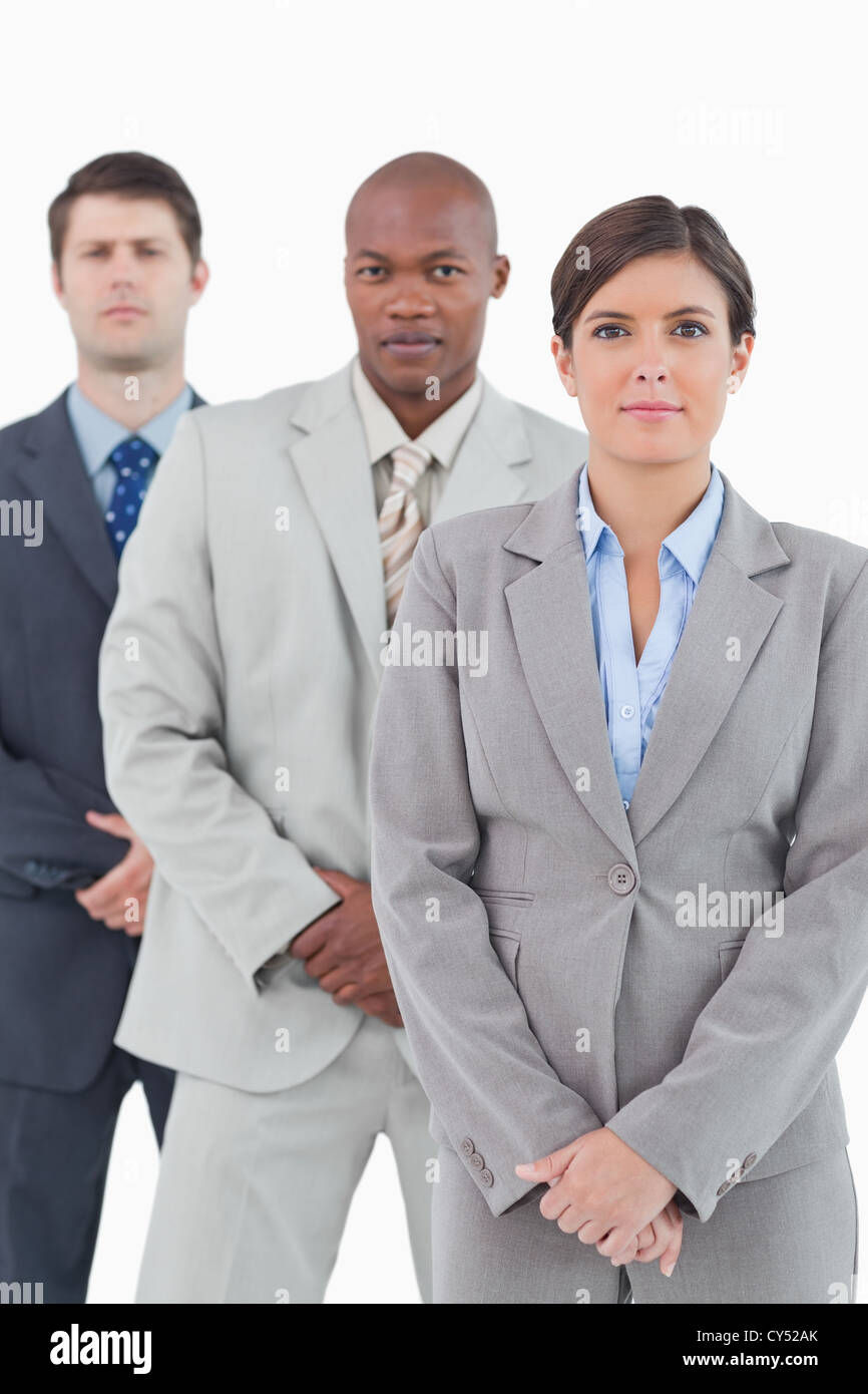 Young sales team standing together Stock Photo - Alamy