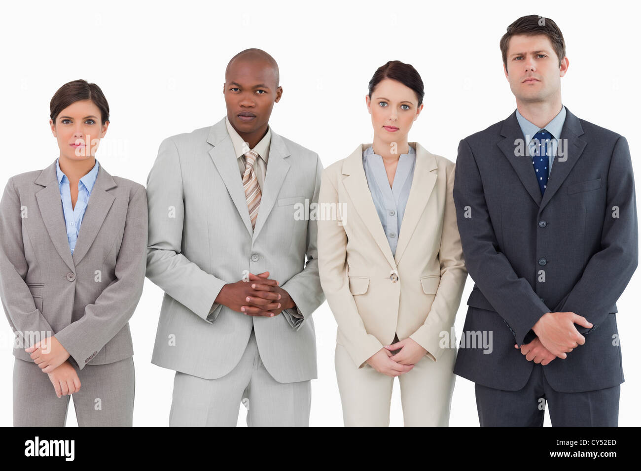 Serious business team standing together Stock Photo - Alamy